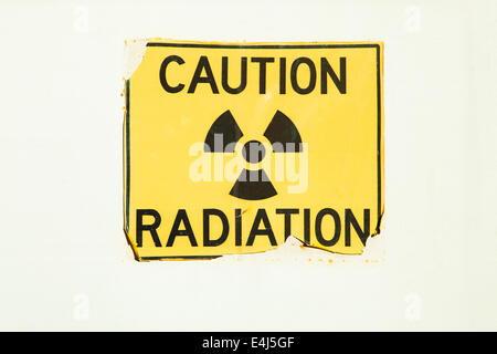 A " Danger Plutonium" warning sign and old oil drums in a backyard ...