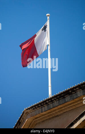 Waving Maltese red flag with a white cross. The symbol of the Knights ...