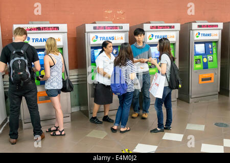 Taking rail ticket from a machine Stock Photo - Alamy