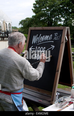 Signwriter making a sign Stock Photo - Alamy