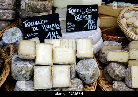 Tomme de Savoie on a market stall at the Saturday market in Chamonix ...