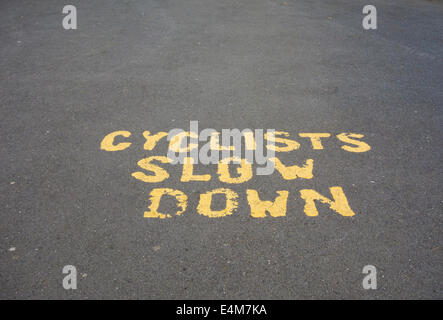 A warning sign for cyclists to slow down at the 14 locks, near Stock ...