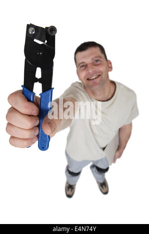 Laborer showing pliers Stock Photo - Alamy