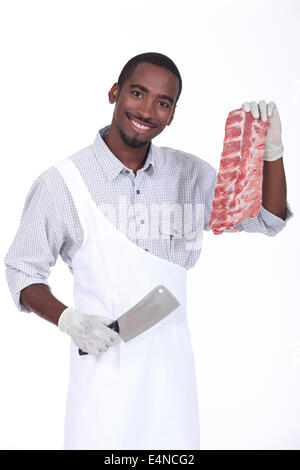 happy African butcher holding fresh meat in butchery Stock Photo - Alamy