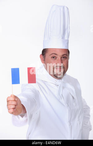 Chef waving a French flag Stock Photo - Alamy