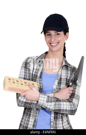 A female mason showing her work Stock Photo - Alamy
