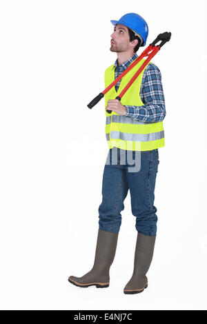 A man holding bolt cutters Stock Photo - Alamy