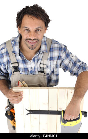 Carpenter with a wooden shutter Stock Photo - Alamy