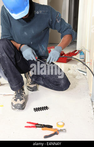 male electrician wiring a junction box Stock Photo - Alamy