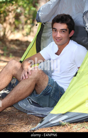 Hairy legs of man sitting in wc with trousers off Stock Photo - Alamy