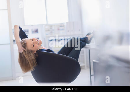 happy young business woman relaxing and geting insiration while working ...