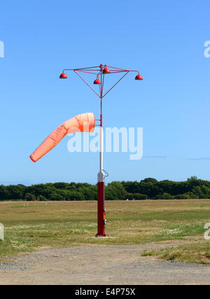 Windsock indicator of wind on runway airport. Wind cone indicating wind ...