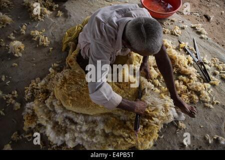 Rajasthan, Rajasthan of India. 15th July, 2014. A man works at a wool ...