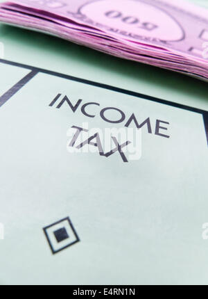 Income tax square on a Monopoly game board Stock Photo - Alamy