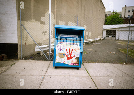 Clothing donation drop off bins for commercial recycling company Stock ...
