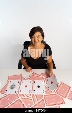Mid-Adult Woman doing Magic Trick with Deck of Cards Stock Photo - Alamy