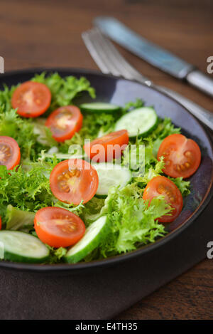 Appetizing cucumber and tomato salad closeup Stock Photo - Alamy
