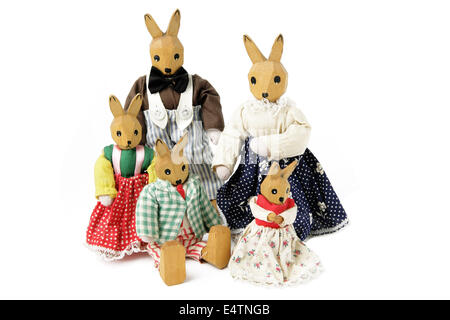 Happy family with toy rabbit sitting on sofa at home Stock Photo - Alamy