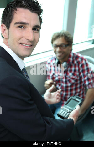Tram conductor checking ticket Stock Photo - Alamy