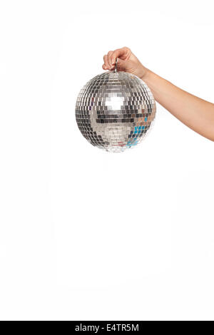 Shiny disco ball hanging over bar counter with cocktails in nightclub ...