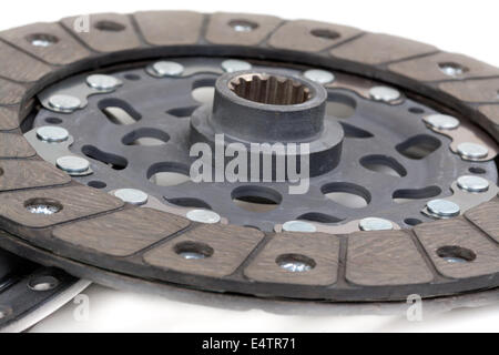 A new set of automotive clutch on a gray background, disc and clutch ...