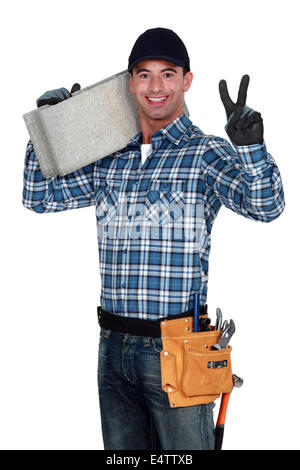 Bricklayer with trowel making a brick wall, Mason with personal ...