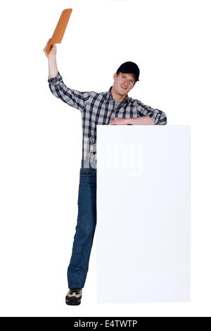 Man holding tile cutter Stock Photo - Alamy