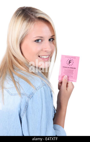 Blonde girl showing driving license Stock Photo - Alamy