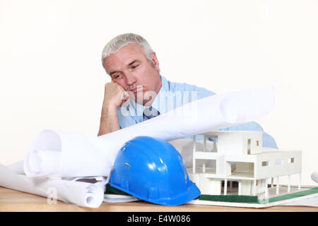 An overwhelmed architect Stock Photo - Alamy