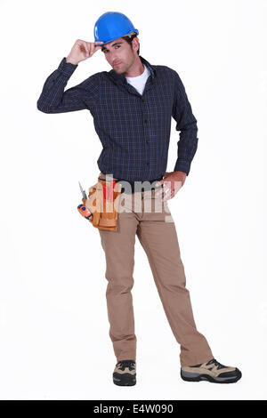 Construction worker giving a salute Stock Photo - Alamy