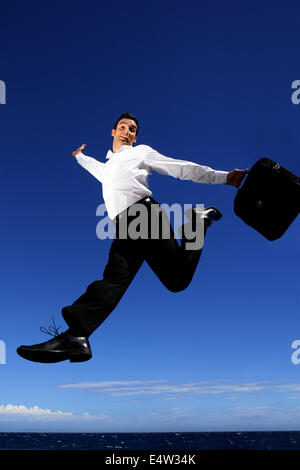Businessman leaping through the air Stock Photo - Alamy