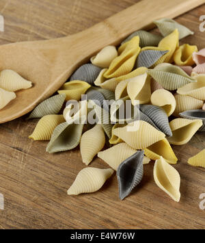 Colorful italian raw pasta on plate. Heap of colorful macaroni Stock ...