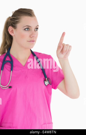 smiling doctor or nurse pointing to something Stock Photo - Alamy