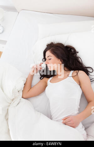 White bed, quilt and pillows in wooden bedroom. hotel bedroom ...