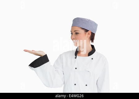 Chef presenting something Stock Photo - Alamy