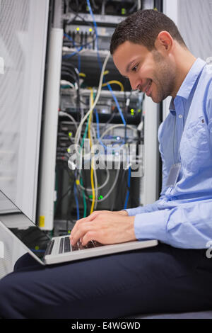 Man fix server network in data center room Stock Photo - Alamy