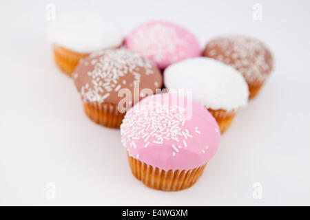 Blurred muffins placed in pyramid against a grey background Stock Photo ...