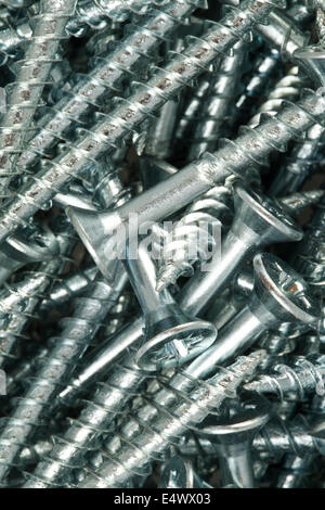 Many silver screws Stock Photo - Alamy