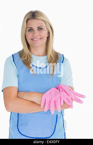 Gloves, cleaning and woman with arms crossed, spray bottle and product ...
