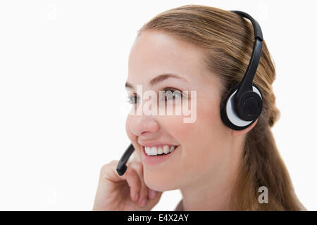 Side view of smiling call center agents at work Stock Photo - Alamy