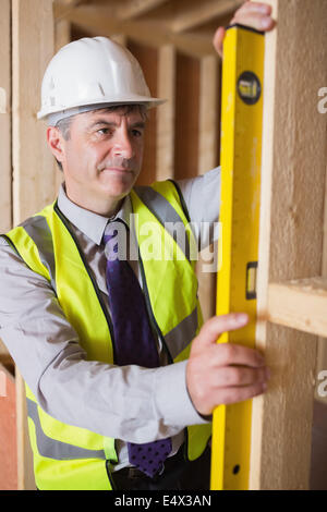 Man measuring wooden window frame for installation net screen insect ...