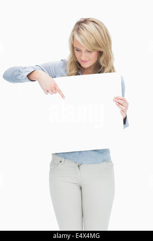 Woman pointing on the piece of paper Stock Photo - Alamy
