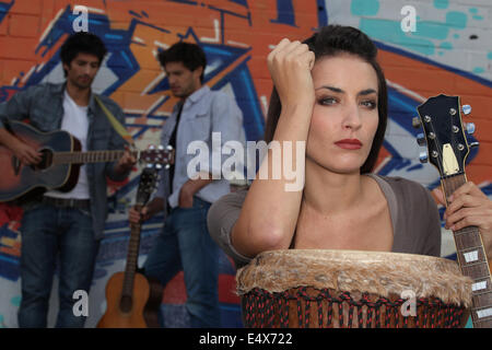 Band standing in front of graffiti Stock Photo - Alamy