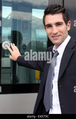 A man pressing a button Stock Photo - Alamy