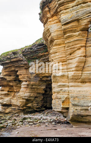 Sandstone rock and cave formation. Hopeman bay coastline, Morayshire ...