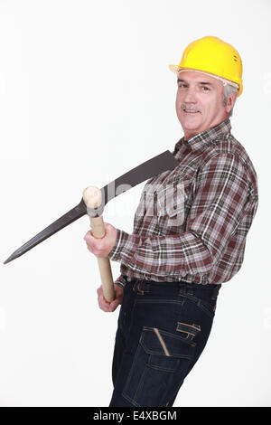 Man with pick-axe Stock Photo - Alamy