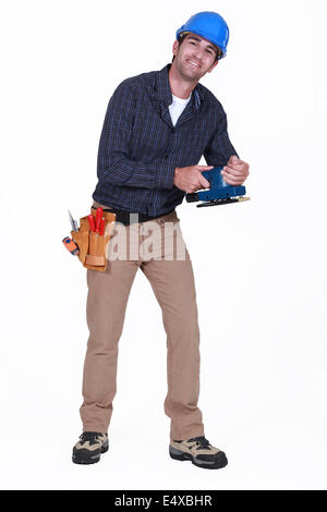 Man using power sander Stock Photo - Alamy