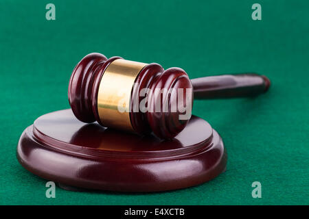 Judicial wooden gavel on a green background. Justice, law symbol. 3D ...