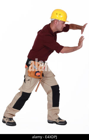 Man pushing invisible wall Stock Photo - Alamy