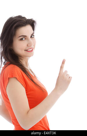 Young brunette points and looks up expressing shock on her face Stock ...